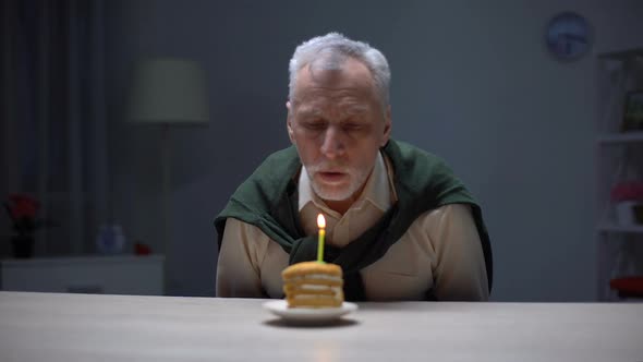 Lonely Old Man Blowing Candle on Piece of Cake, Celebrating Lonely ...