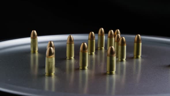 Cinematic rotating shot of bullets on a metallic surface - BULLETS 050 ...