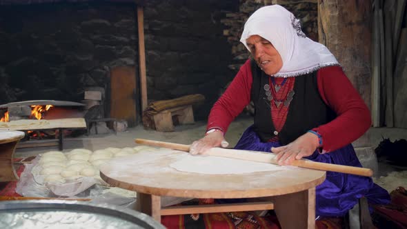 Peasant Woman Preparing Turkish Traditional Bread In Village House ...