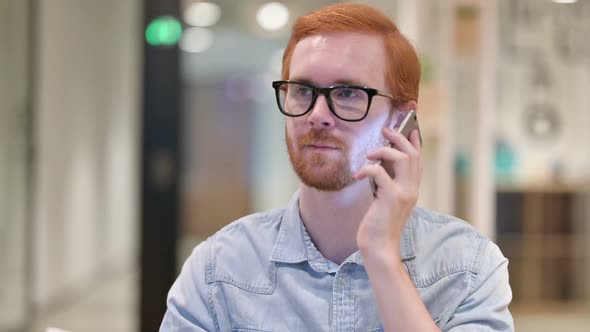 Cheerful Young Redhead Man Talking on Smartphone, Stock Footage | VideoHive