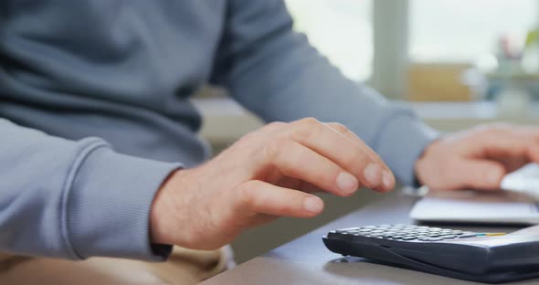 Man calculating on calculator 4k, Stock Footage | VideoHive