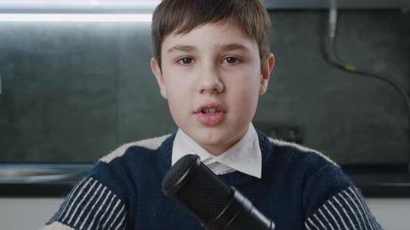 Boy Vlogger Look at Camera and Recording Podcast Video for Internet ...