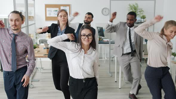 Cheerful Business Team Dancing Together Smiling Looking at Camera ...