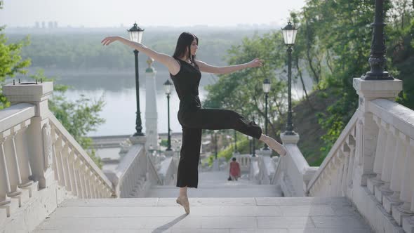 Slim Ballerina Doing Ballet Steps on Urban Stairs on Sunny Day, Side ...