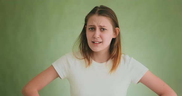Strange Woman Shrugs Sarcastically Posing for Studio Camera, Stock Footage