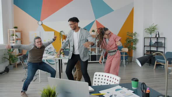 Cheerful Young People Coworkers Dancing at Office Business Party Having ...