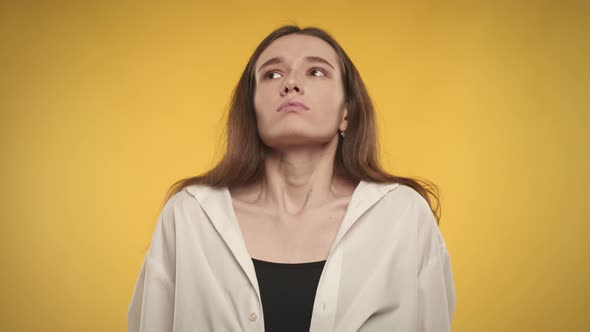 Woman Taking a Deep Breath and Exhale on a Bright Yellow Background ...