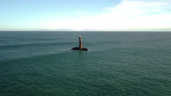 Flying towards and over the Karori Rock Lighthouse in the Cook Strait ...