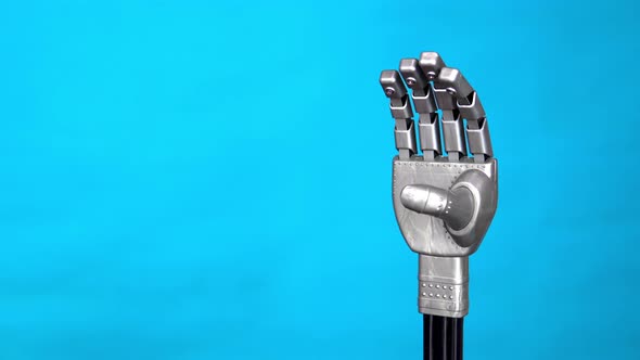 A Mechanical Arm Flexes Fingers. Gray Cyborg Arm Came To Life and Began ...