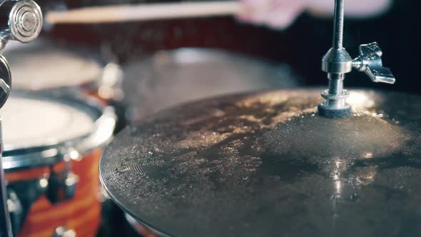 A Musician Plays Drums, Hitting Cymbal. Drummer Hitting on Wet Drum ...