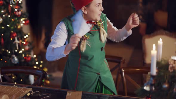 Curious elf looking at envelopes in the decorated room., Stock Footage