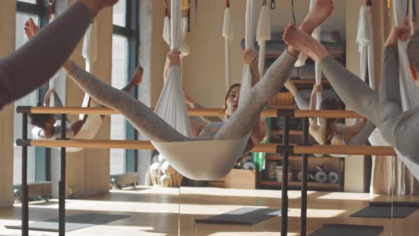 Girls Hanging Upside Down at Aerial Yoga Class, Stock Footage | VideoHive