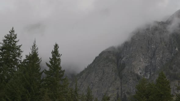 Timelapse of Clouds Rolling Cliff Face on Mountain by BlackBoxGuild