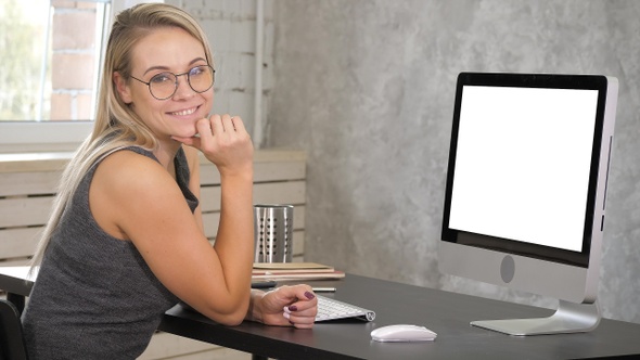 Young Woman Smiling to Camera Sitting on Her Working Place, Stock Footage