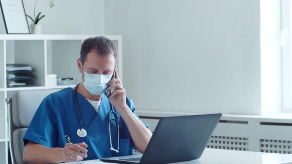 Professional medical doctor working in hospital office using computer ...