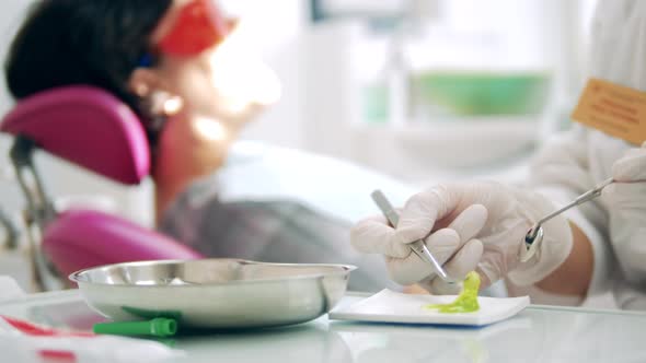 Dentist is Applying Paste Onto Patient's Teeth, Stock Footage | VideoHive