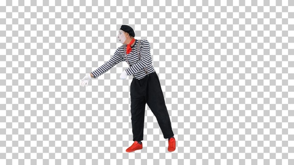 Male mime artist performing pulling virtual rope, Alpha Channel, Stock ...