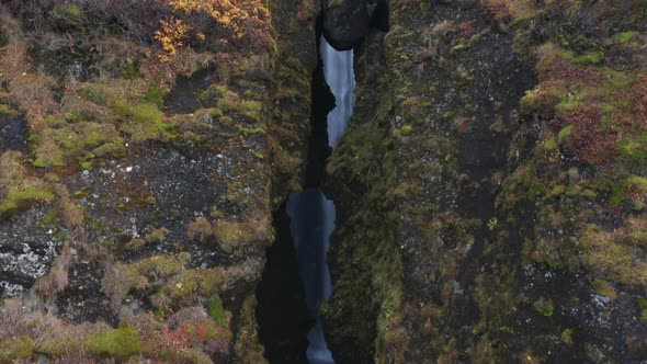Drone Of Waterfall Through Gap Between Two Cliffs, Stock Footage ...