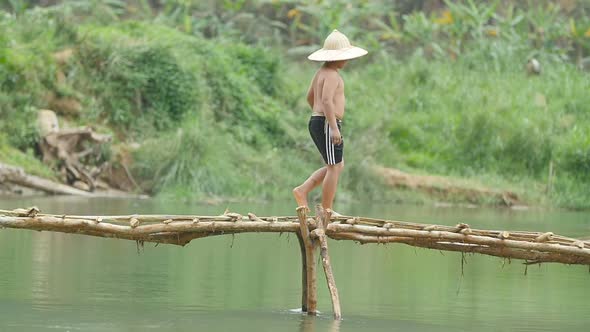 Rural Boy Walking Through The River, Stock Footage | VideoHive