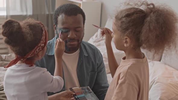 Little Girls Doing Dads Makeup for Fun, Stock Footage | VideoHive