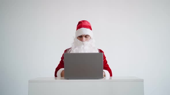 Santa Claus Typing Text on Laptop Keyboard on White Background, Stock ...