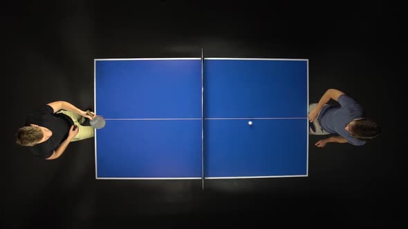 Two Young Men Playing Ping Pong Game Enjoying Competitive Sport in Dark ...