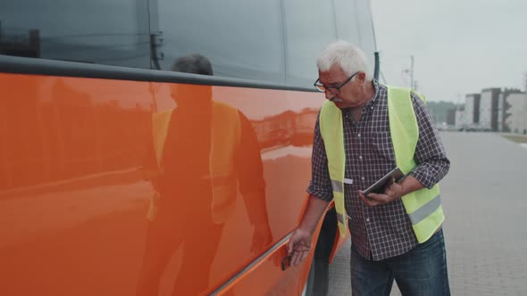 Senior Bus Driver Checking Transport Before Ride, Stock Footage | VideoHive