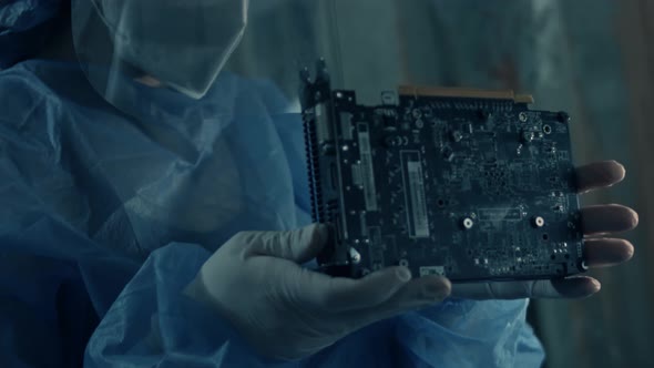 Macro View of Female Engineer's Hands Holding and Closely Analizing a ...