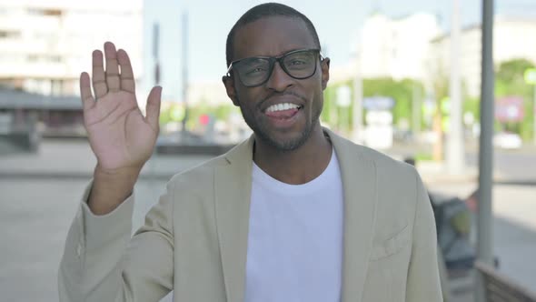 Welcoming African Man Waving Hand for Hello Outdoor, Stock Footage