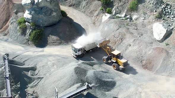 Aerial view of Extracting and transportation of rocks in a shale quarry ...