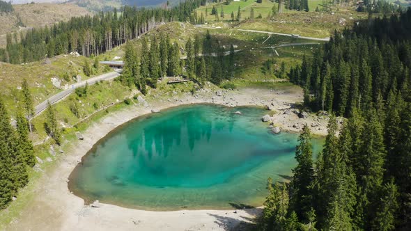 Beautiful camera crane of Lago di Carezza, the distending movement show ...