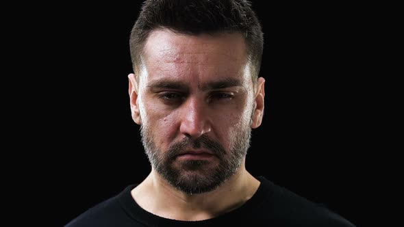 Poor Crying Man Looking at Camera Isolated on Black Background, Life ...