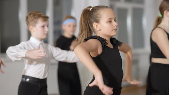 Portrait of Beautiful Little Girl Dancing with Classmates in Dancing ...
