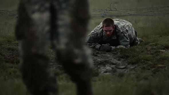 Soldiers crawling under low barbed wire, Stock Footage | VideoHive