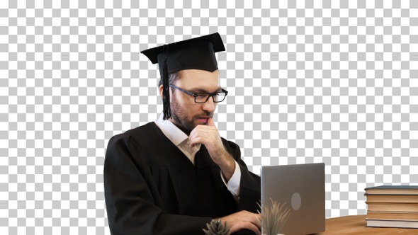 Serious grad student using a laptop, Alpha Channel, Stock Footage ...