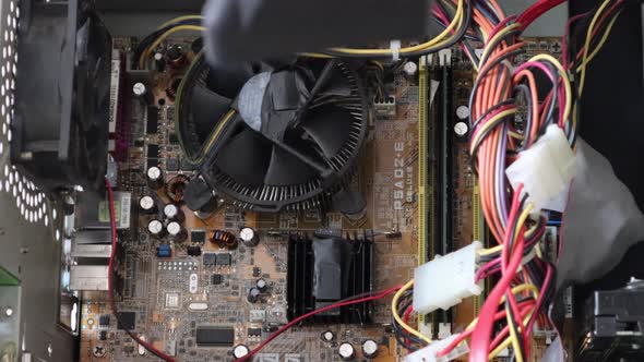 Blowing dust off a computer circuit board - Close up, Stock Footage