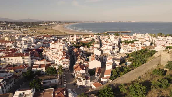 Fly over Lagos city, Algarve, by the Atlantic Ocean. Sand beach and sea ...