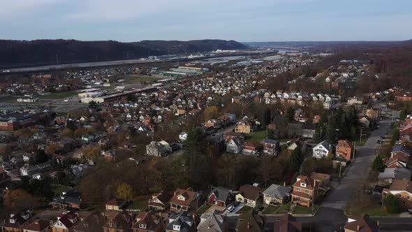 A forward aerial view of a small rust belt town in the Pennsylvania ...