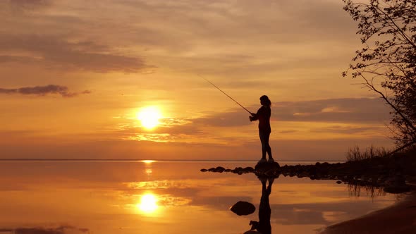 Woman Fishing on Fishing Rod Spinning, Stock Footage | VideoHive
