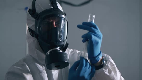 Paramedic in a Hazmat Suit Is Preparing a Syringe for an Injection ...