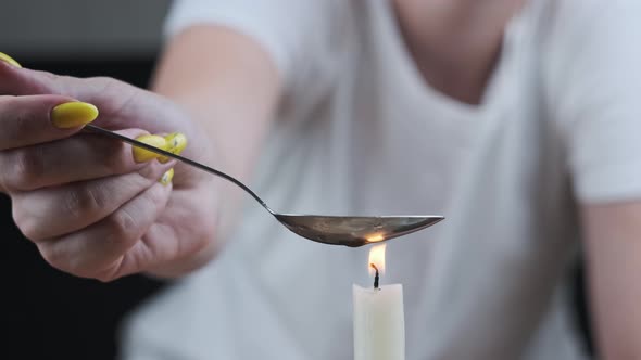 Woman Drug Addict Cooking Drugs in Spoon on Candle Flame, Stock Footage