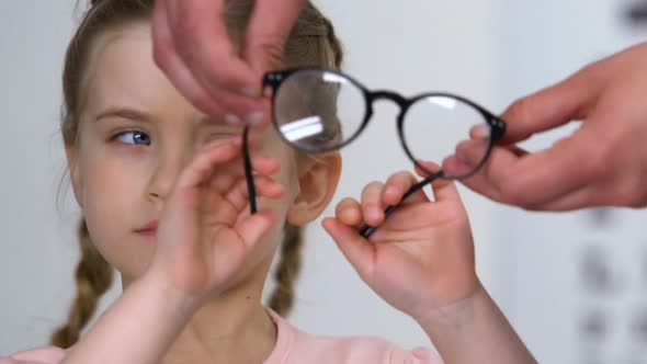 Little Girl Refusing Eyeglasses Offered by Doctor Child Insecurities ...