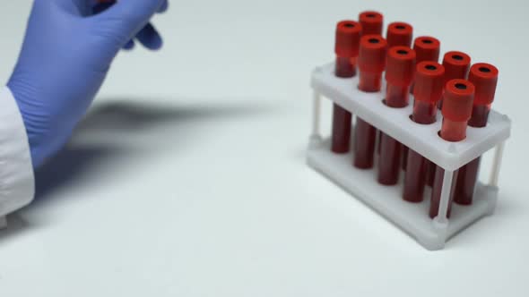 Positive Beta hCG Test, Doctor Showing Blood Sample in Tube, Health ...