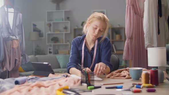 Portrait of a Young Woman Dressmaker at Home in the Living Room, Stock ...