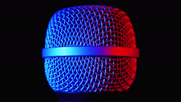 Microphone Rotates with Blue and Red Backlight. Dynamic Microphone Grid ...