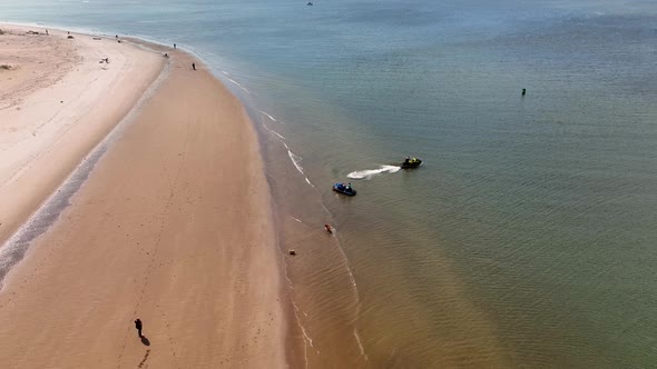 An aerial view of the beach at Gravesend Bay in Brooklyn, NY as two jet ...