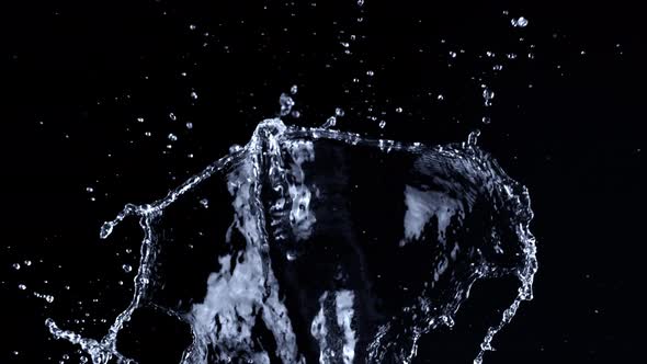Super Slow Motion Shot of Water Splash Isolated on Black Background at ...