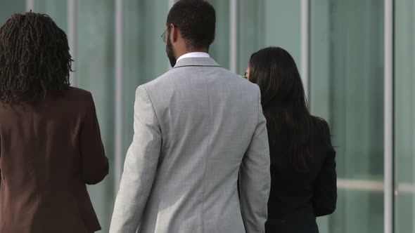 Back View of Three People Wearing Suits Walking Near Building, Stock ...