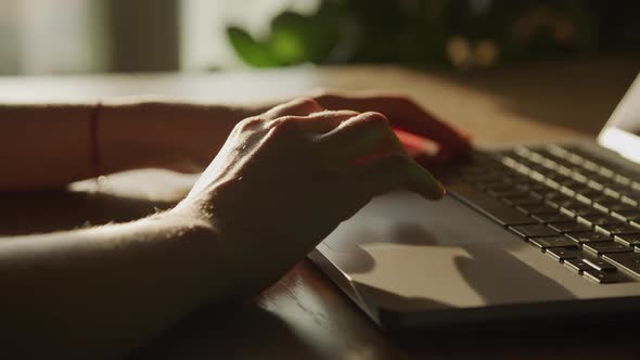 Close Up Woman Hand Entering Frame and Swiping Sideways on a Laptop ...