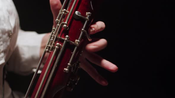 Closeup of Fingers Female Musician Playing the Bassoon Keys Side View ...